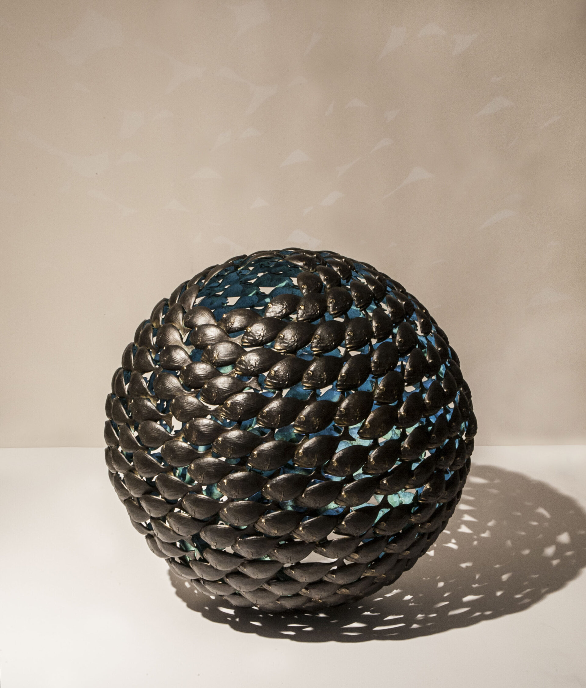 Fishball E2 (FSB) - Bronze sphere sculpture made of a school of fish ...
