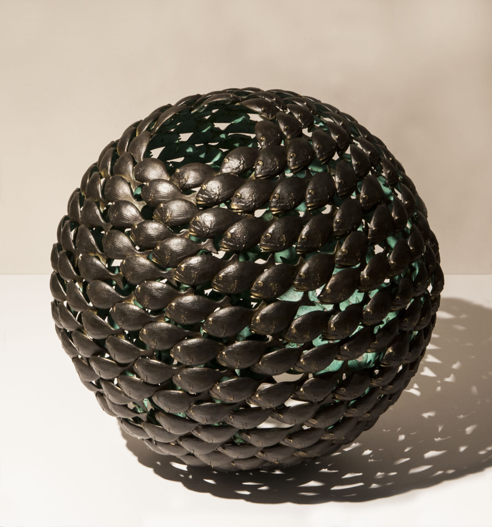 Fishball E2 (FSB) - Bronze sphere sculpture made of a school of fish ...